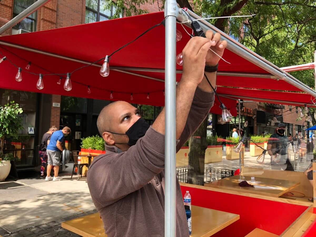 PHOTOS: Volunteers build outdoor seating as in-street dining comes to ...